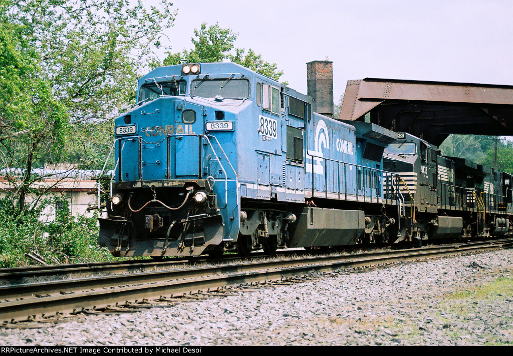 NS C40-8W #8339 leads a westbound out of the yard